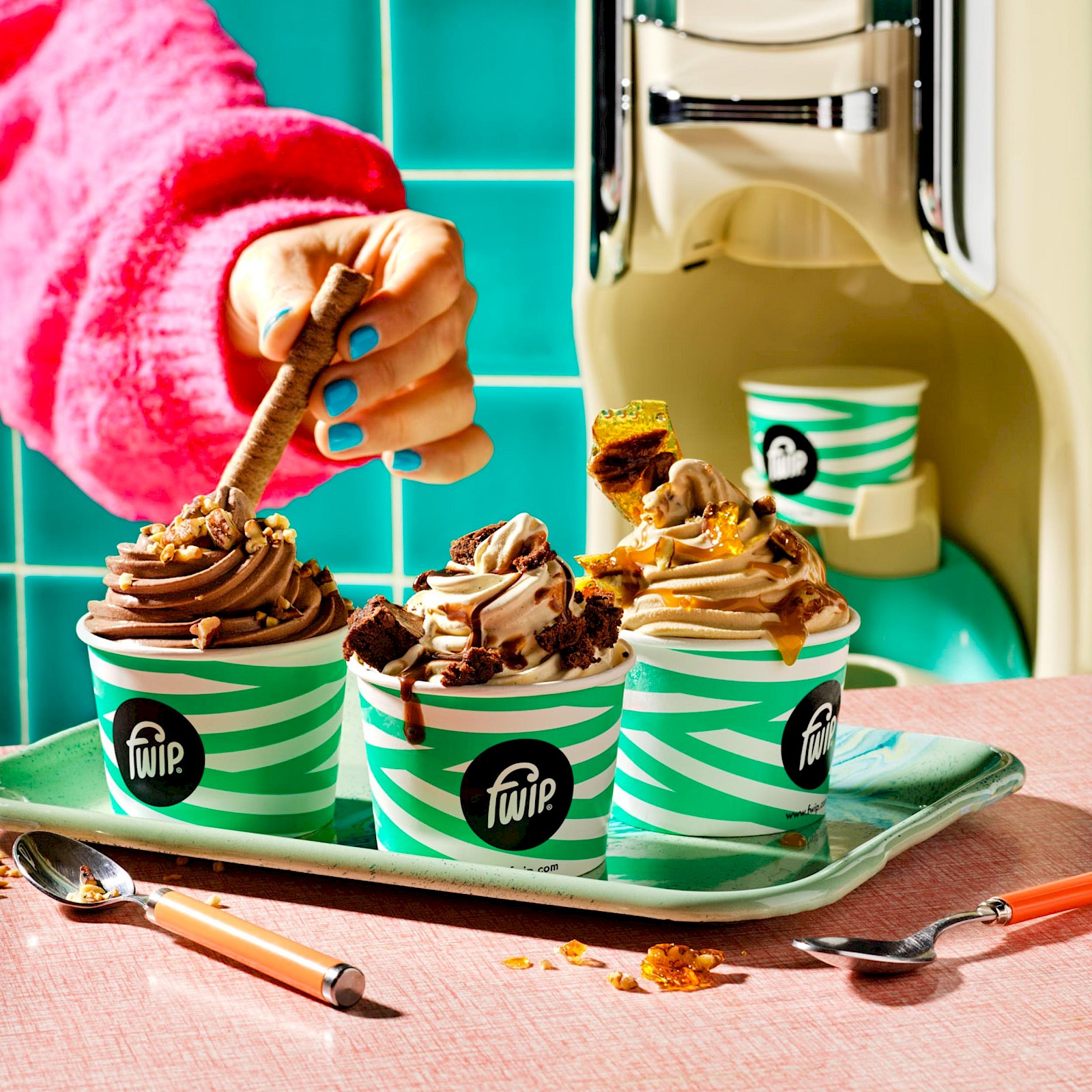 Fwip ice cream tubs with machine in background - Karen Thomas Photography